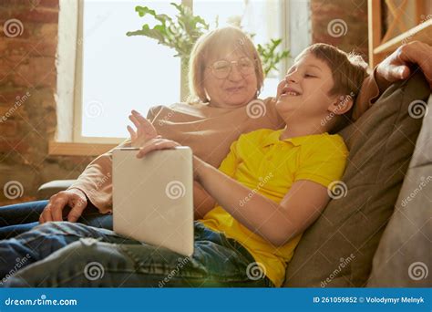 Granny And Grandson Make A Stretching Stock Image