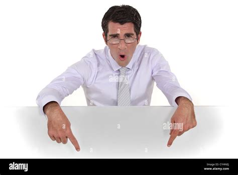 A Businessman Pointing At A Blank Poster Stock Photo Alamy