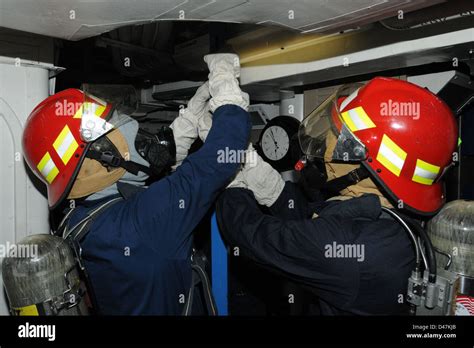 Sailors Aboard The Uss Forrest Sherman Respond To Simulated Flooding During General Quarters