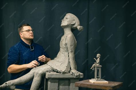 Premium Photo Man Sculptor Creates Sculpt Bust Clay Human Woman