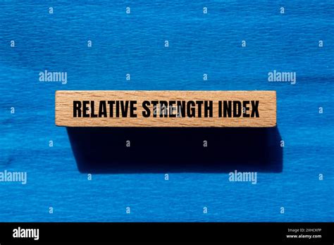 Relative Strength Index Message Written On Wooden Block With Blue Background Conceptual