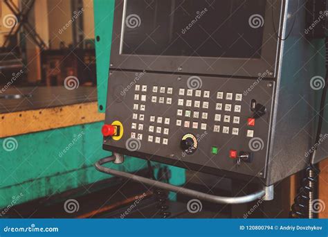 The Worker Uses The Control Panel Of The Cnc Machine To Process The