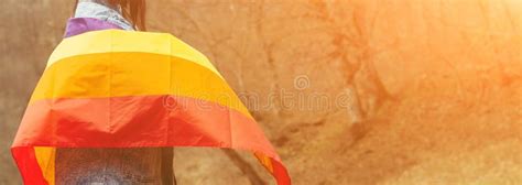 Celebrating The Lgbt Lesbian Women Rights Woman Holding The Rainbow Flag On The Nature Stock