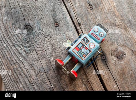 robot toy symbol for a chatbot or social bot and algorithms wood
