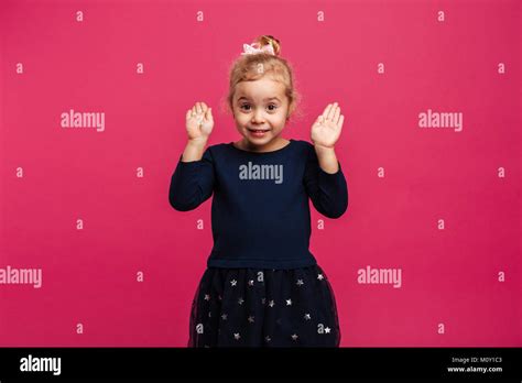 Beauty Young Blonde Girl Showing Her Palms And Looking At The Camera
