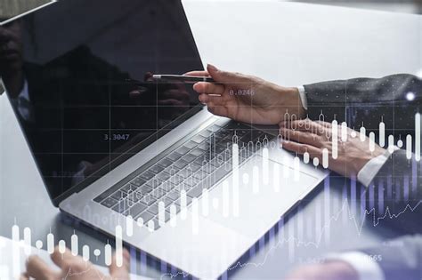 Premium Photo Two Traders Researching Historic Data To Predict Stock Market Behavior Using