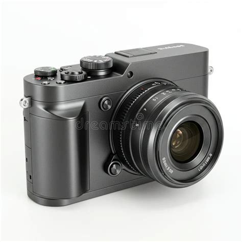 A Compact Black Digital Camera With A Wide Angle Lens Featuring
