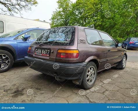 Old Classic Rusty Small Compact Car Toyota Corolla From Eighties Parked