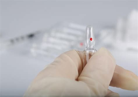Premium Photo Glass Ampule With Medication In The Hand Of Medical