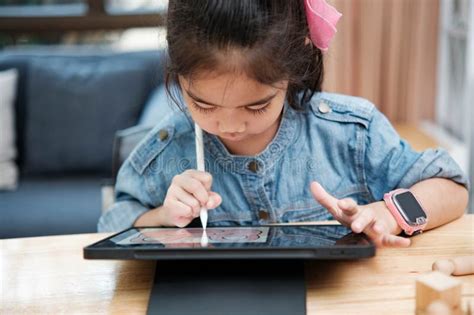 A Young Girl Is Playing With A Remote Control A Robot Stock Image Image Of Girl Experiment