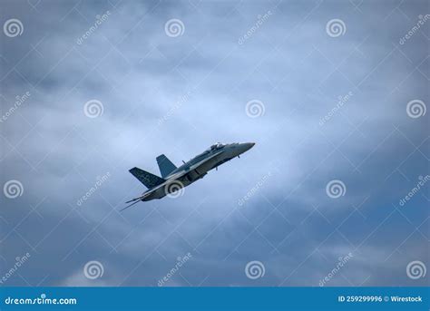 Royal Canadian Air Force Cf 18 Hornet Banked Turn Over On Cloudy Sky Springbank Airport Alberta