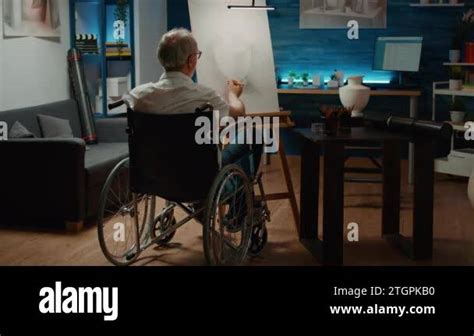 Senior Man With Disability Drawing Sketch Of Vase Inspiration Using