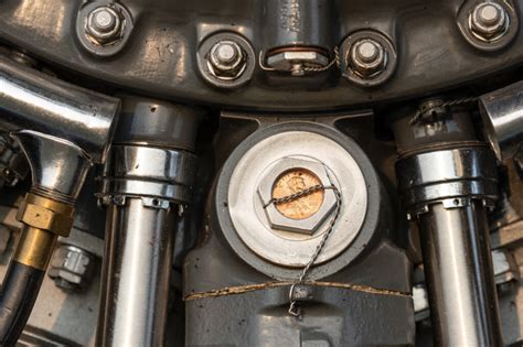 Close Up Of A T6 Airplane Engine Showing A Penny Coin Wired To T