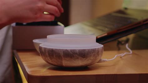 Woman Adds Essential Oil Into Diffuser In Kitchen Stock Video At Vecteezy