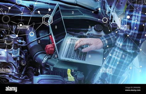 Car mechanic using laptop for checking car engine; light effect Stock Photo - Alamy