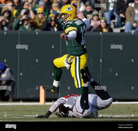Green Bay Packers Aaron Rodgers Scrambles During The First Half Of An Nfl Football Game Against