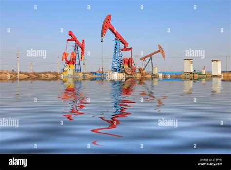 Pumping Unit And Reflection In Oilfield Stock Photo Alamy