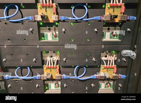 Electronic Circuit Board Connections With Blue Ethernet Cables Green