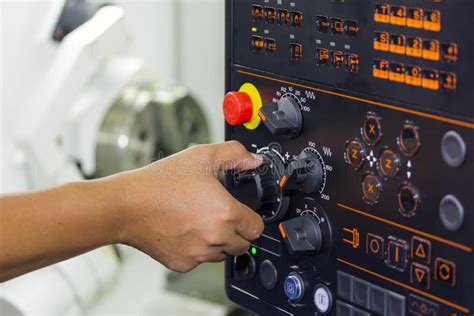 Operator Use Hand Turns Dial Switch Control At Panel For Adjust Parameter Of Cnc Lathe Machine