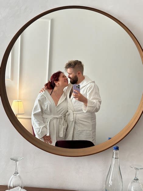 Premium Photo Millennial Couple Relaxing In Hotel Robes Captured In A