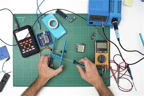 Assembling Electronic Device By Science Photo Library