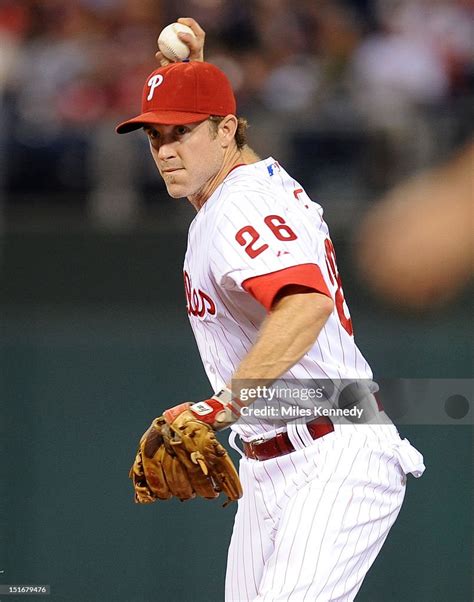 Chase Utley Of The Philadelphia Phillies Throws To First Base Against