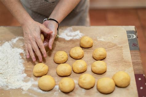 Premium Photo Female Hands Making Small Balls With Raw Short Pastry