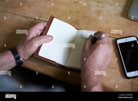 Man Writing In Notebook Close Up Stock Photo Alamy