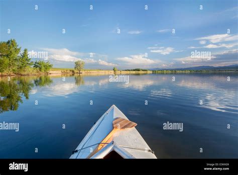 Decked Canoe Bow With A Paddle On A Calm Lake Lonetree Reservoir Near