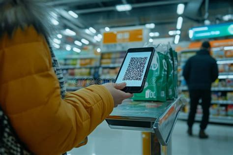 Person Using Smartphone To Scan Qr Code At Supermarket Self Checkout