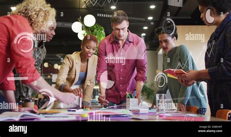 Image Of Statistical Data Processing On Team Of Diverse Colleagues Discussing Together At Office