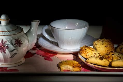 White Tea Set Or Teacup With Chocolate Chip Cookies Close Up Table
