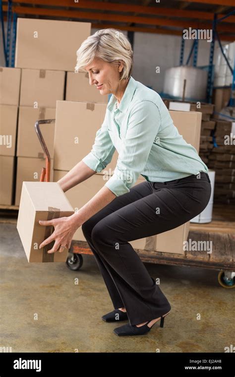 Woman Picking Up Mature Boxes Hi Res Stock Photography And Images Alamy