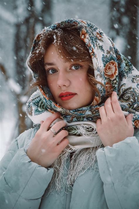 a woman wearing a scarf in the snow