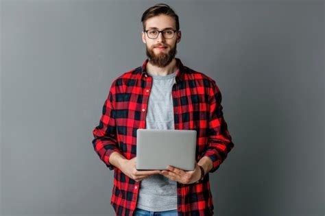 Portrait Of Smart Software Developer In Casual Attire With Netbook Premium Ai Generated Image