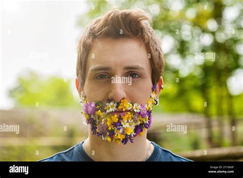 Nature Provides Backdrop To A Redhead Face Adorned With Blooms