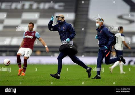 Tottenham Hotspur Medical Staff Run Onto The Pitch During The Premier