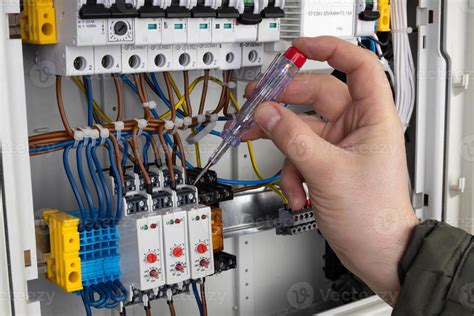Technician Using Voltage Tester On Wiring 47701591 Stock Photo At Vecteezy