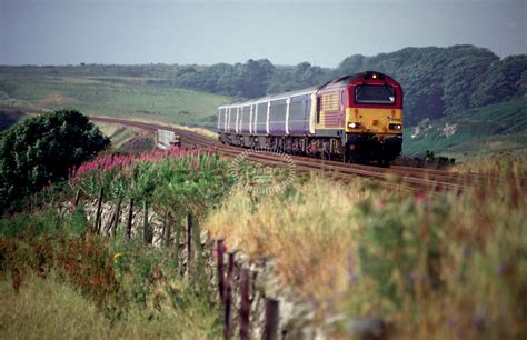 The Transport Library An Ews Class 37 Locomotive Pulls A Scotrail