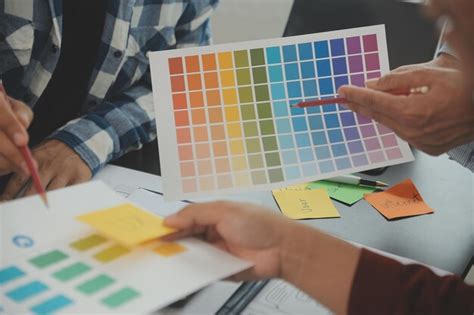 Premium Photo Close Up Ux Developer And Ui Designer Brainstorming About Mobile App Interface