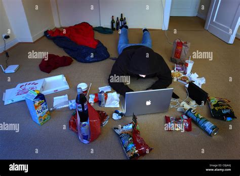 Computer User Hacker Sits Conspiratorially In An Empty Apartment
