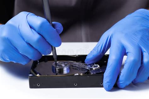 Repair Hard Disk Hands Of Master In Gloves With Screwdriver Repair The Computer Hard Drive