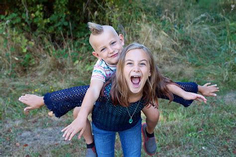 Nine Year Old Girl And Her Five Year Old Brother Goofing Off By