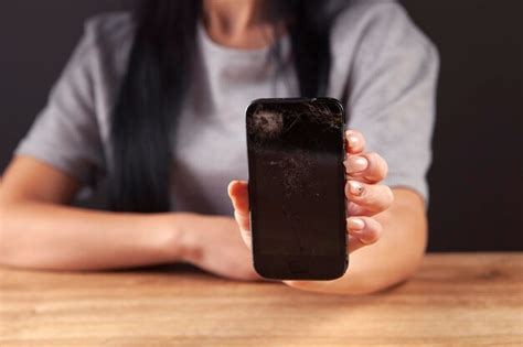 Premium Photo Woman Hand A Broken Phone