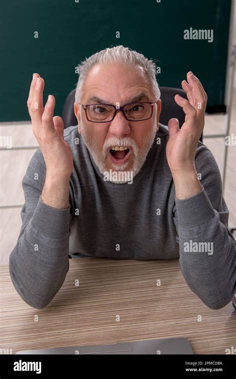 Old Teacher In The Classroom Stock Photo Alamy
