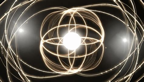 Premium Photo Power Energy Rotating Atom Cell Element Background
