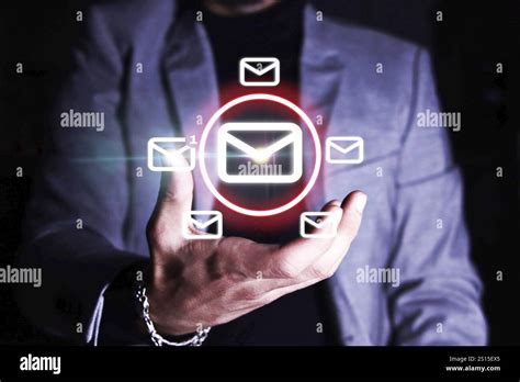 A Businessmans Hand Presenting A Floating Email Notification Icon