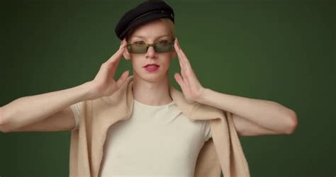 Fashinable Non Binary Man Posing On Camera On Color Background People