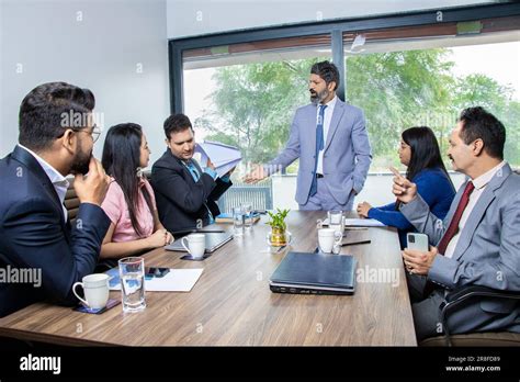 Angry Indian Boss Screaming At Male Employee For Bad Work Businessman