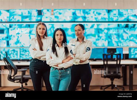 Group Portrait Of Female Security Operator While Working In A Data System Control Room Offices